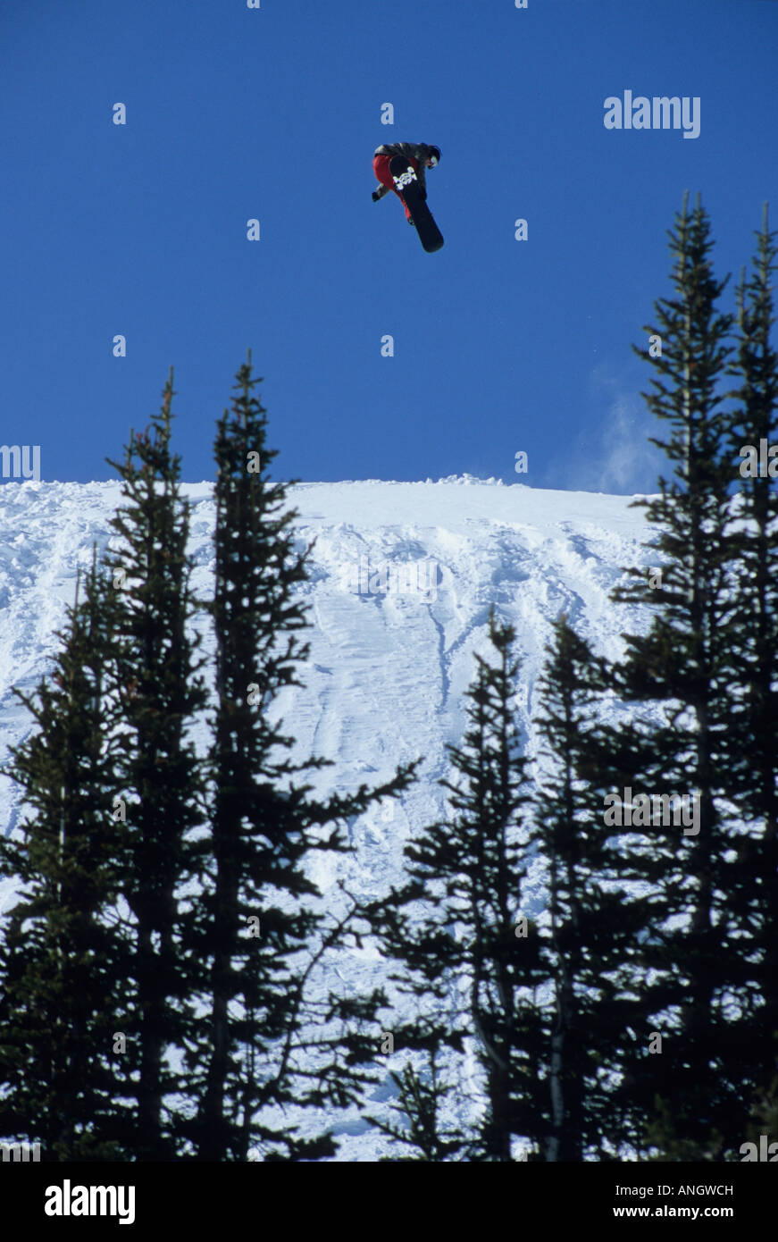 A snowboarder catching big air at Sunshine Resort in Banff National ...
