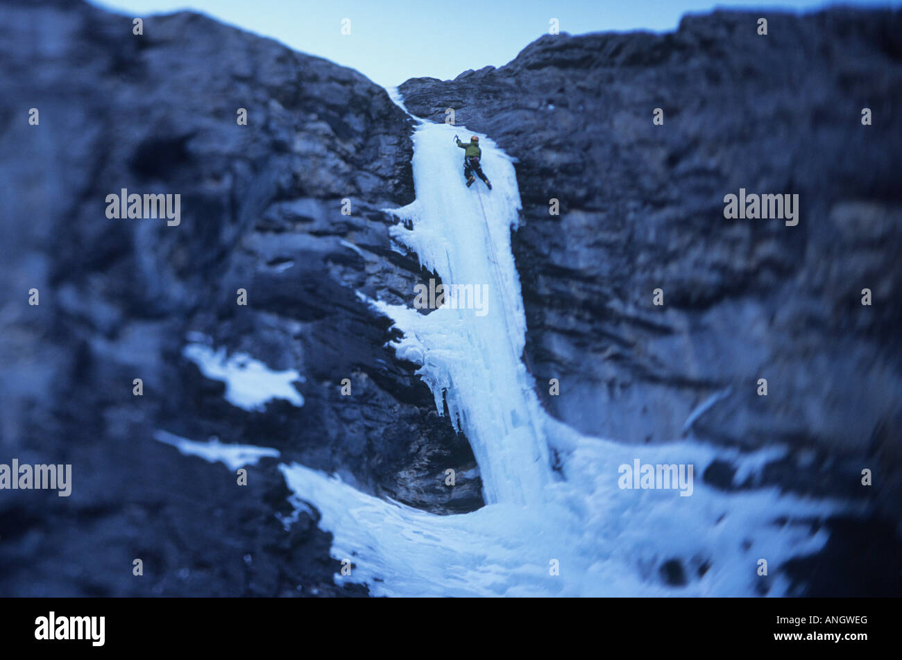 Man climbing icefalls in Ghost River, Alberta, Canada Stock Photo - Alamy