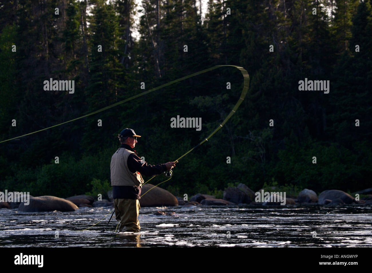 Fisherman fly fishing at white bear river falls hi-res stock ...