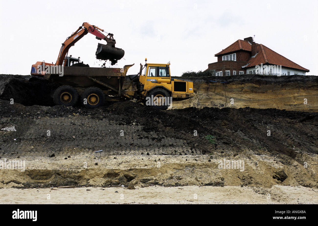 Soil being used to repair the cliffs after high tides caused coastal ...
