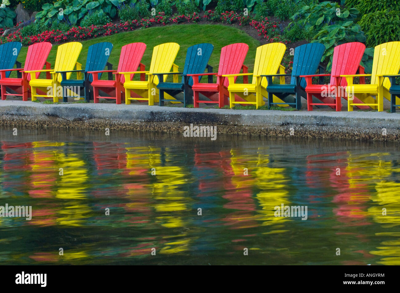 Muskoka chairs reflected in Lake Rosseau, Minett, Ontario, Canada Stock ...