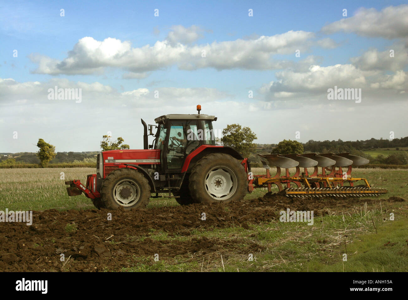 Tractor and Plough Stock Photo - Alamy