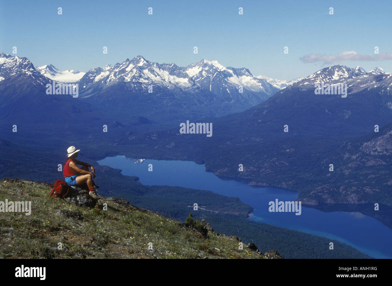 Hiker overlooking Tatlayoko Lake & Coast Mountains, Chilcotin region ...