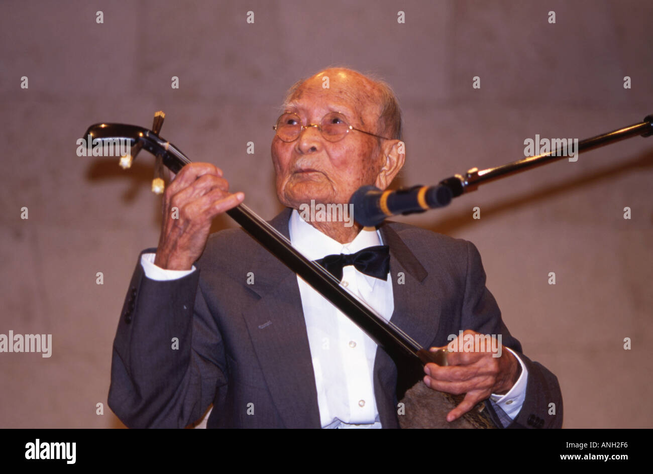 Old man playing music instruments hi-res stock photography and images ...
