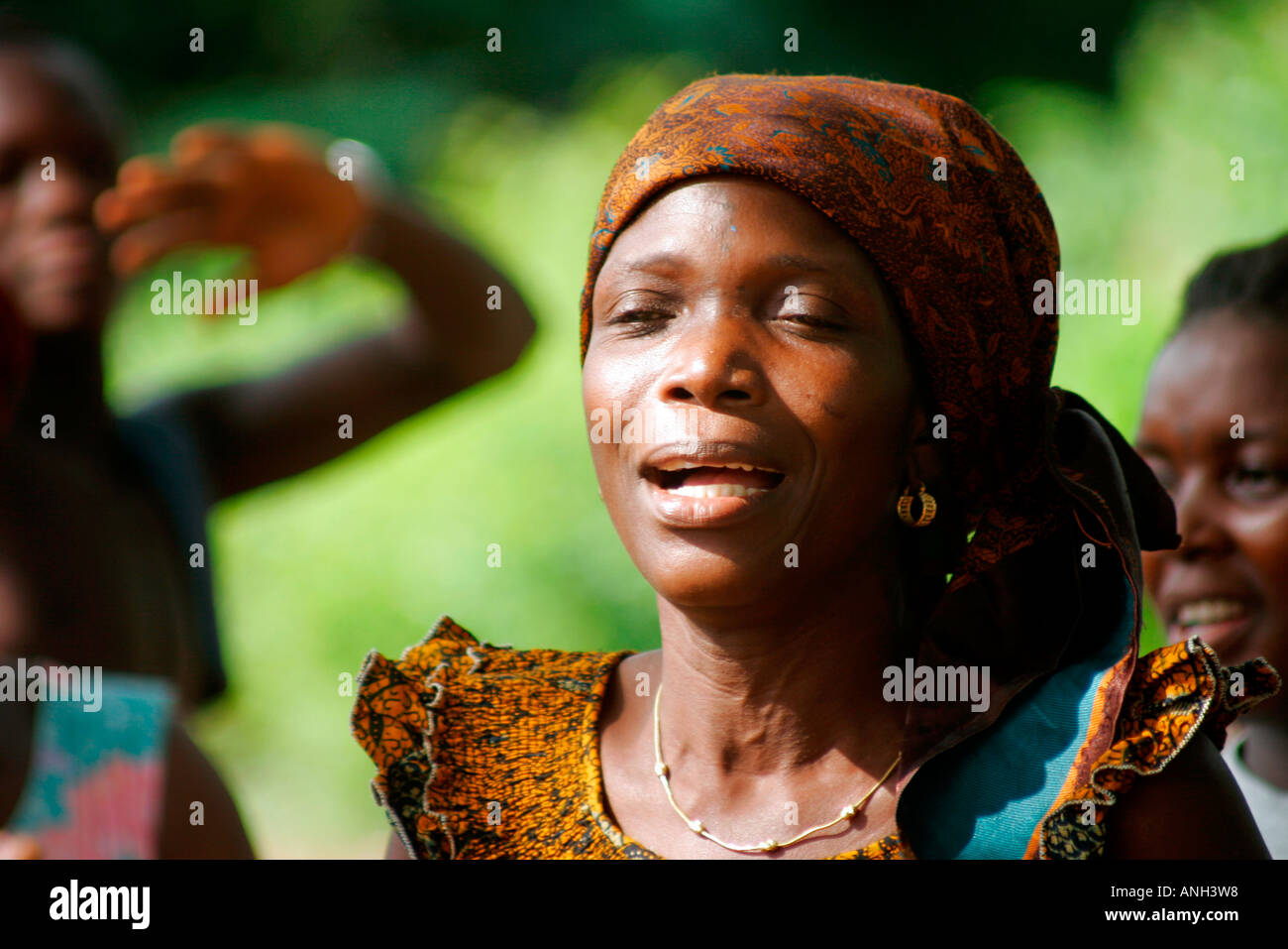 A rural African woman from Togo sings and dances in joy after her ...