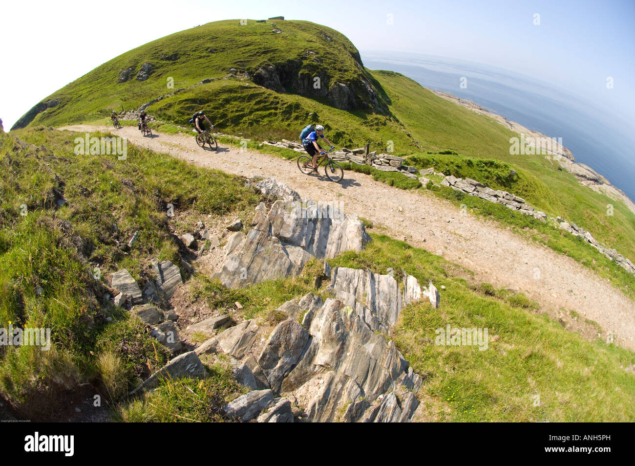 Mountain bikers cycle the trails of west Islay Scotland UK Stock Photo ...