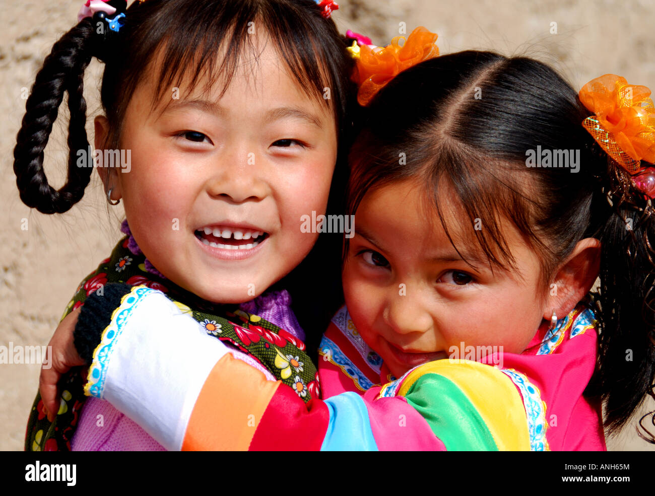 Qinghai Huzhu tu minority two beautiful girl hug each other Stock Photo ...