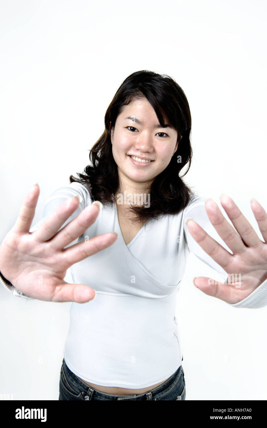 Asian girl saying stop with her hands Stock Photo - Alamy