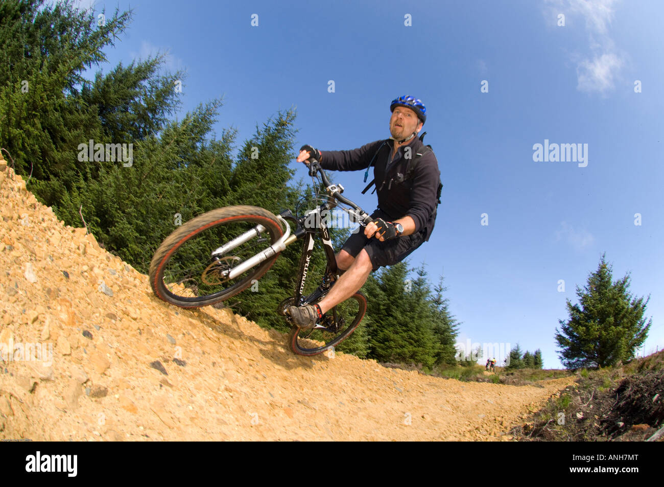 Riders mountain bike the man made trails in Kielder Forest near the ...