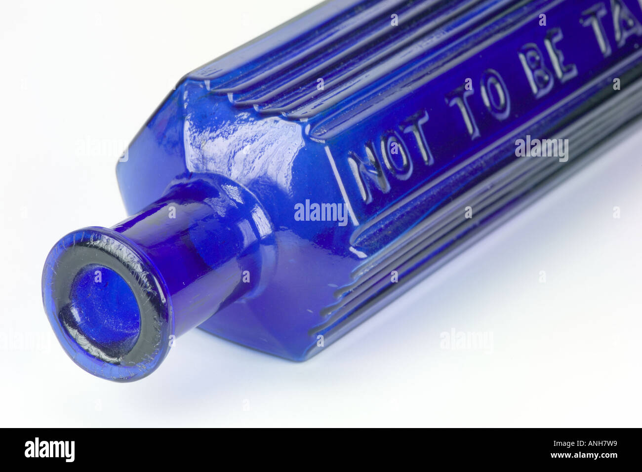 Blue Poison old glass medicine bottle Stock Photo - Alamy