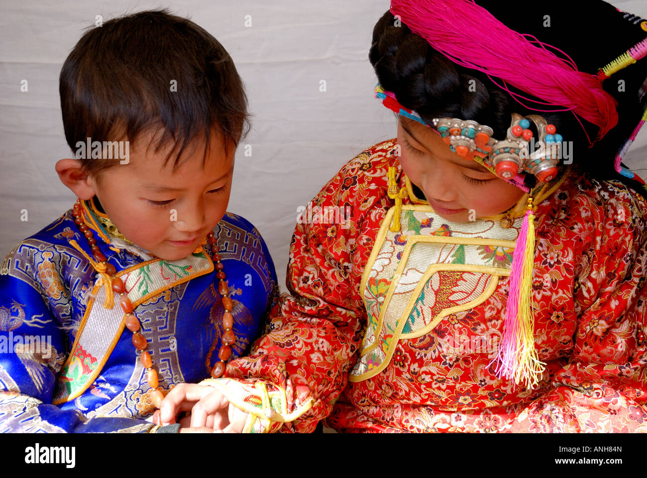 Tibetan wedding party a boy and girl have traditional Tibetan clothes ...