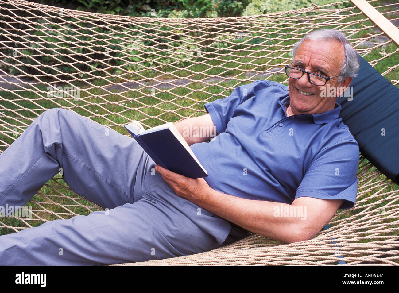 A man reading in a hamock, British Columbia, Canada Stock Photo - Alamy
