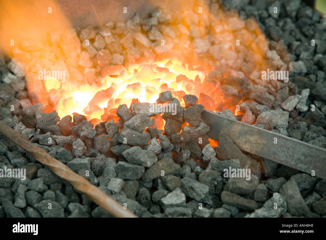 red hot metal in furnace ready for a blacksmith Stock Photo - Alamy