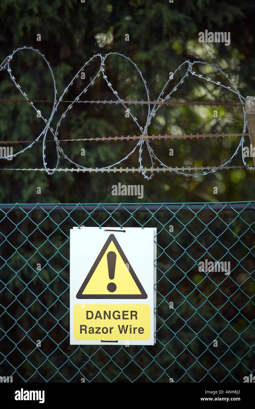 Danger Razor Wire Fence Warning Sign Stock Photo - Alamy