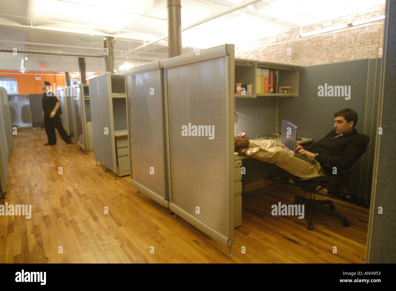 An office drone works in his cubicle Stock Photo - Alamy