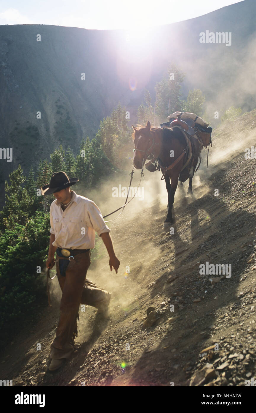 leading a horse in the South Chilcotin Mountains, near Gold Bridge ...