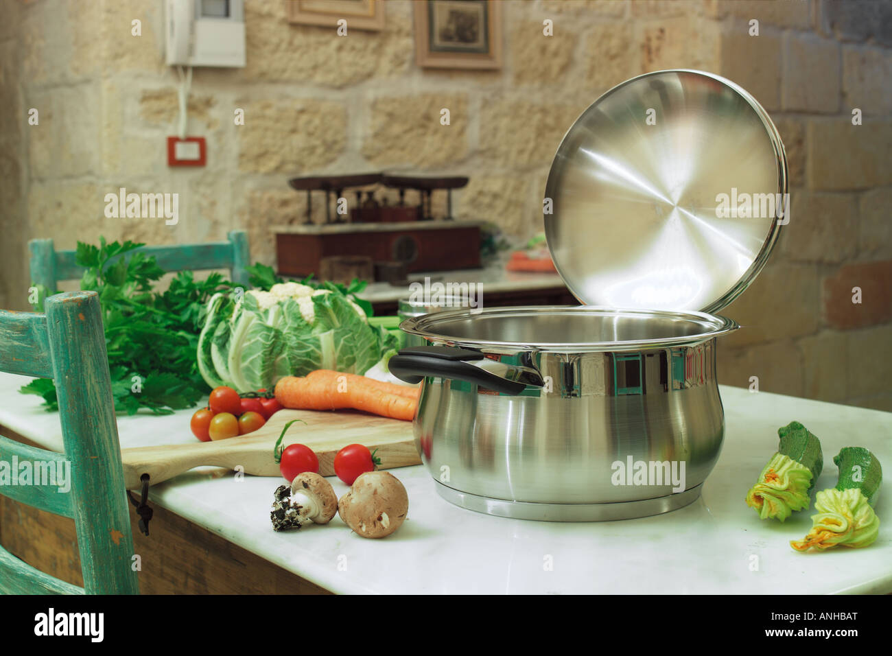 pot on the table in the kitchen with vegetable Stock Photo - Alamy