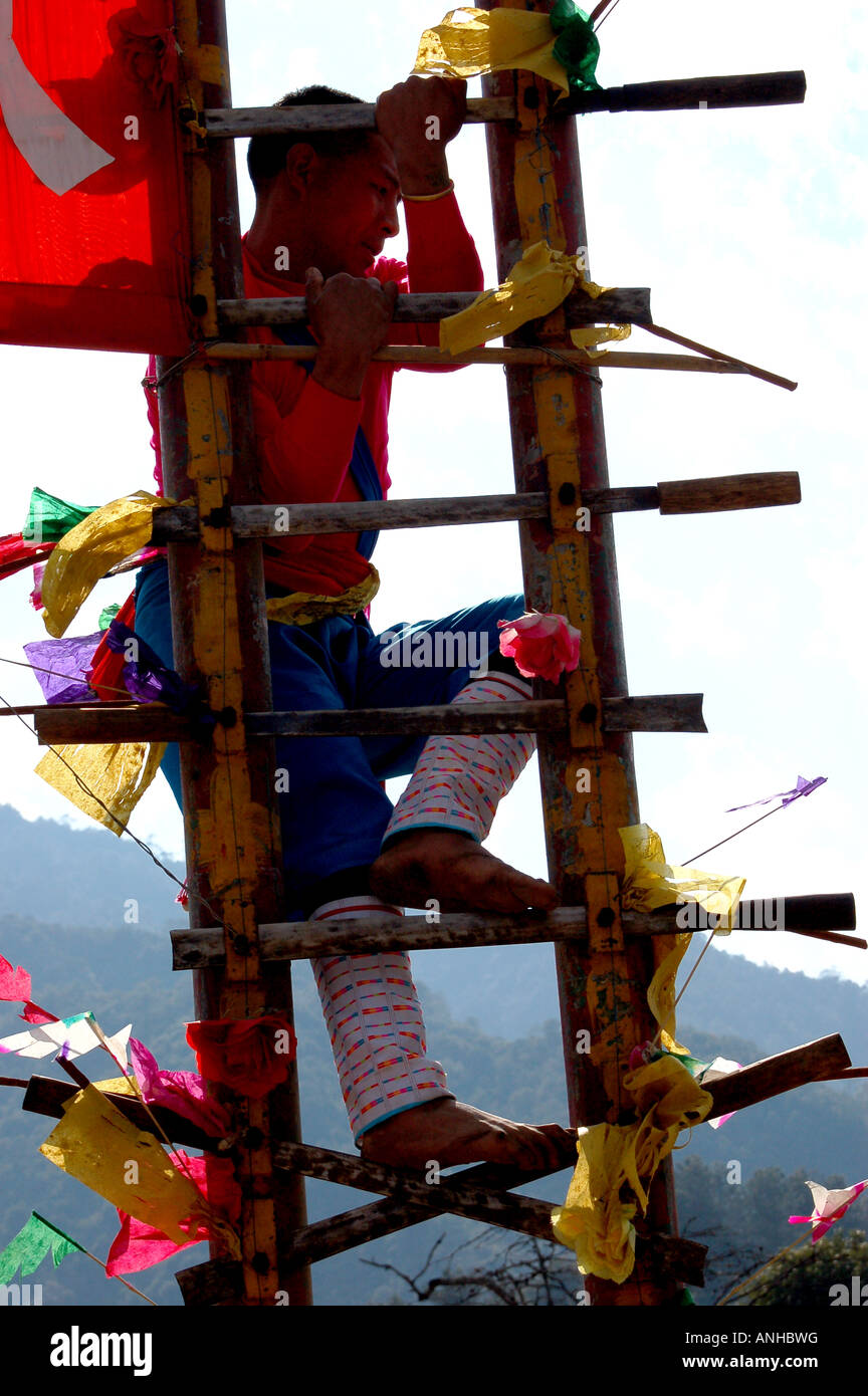 China Yunnan Baoshan lisu minority festival people climb knife Stock ...