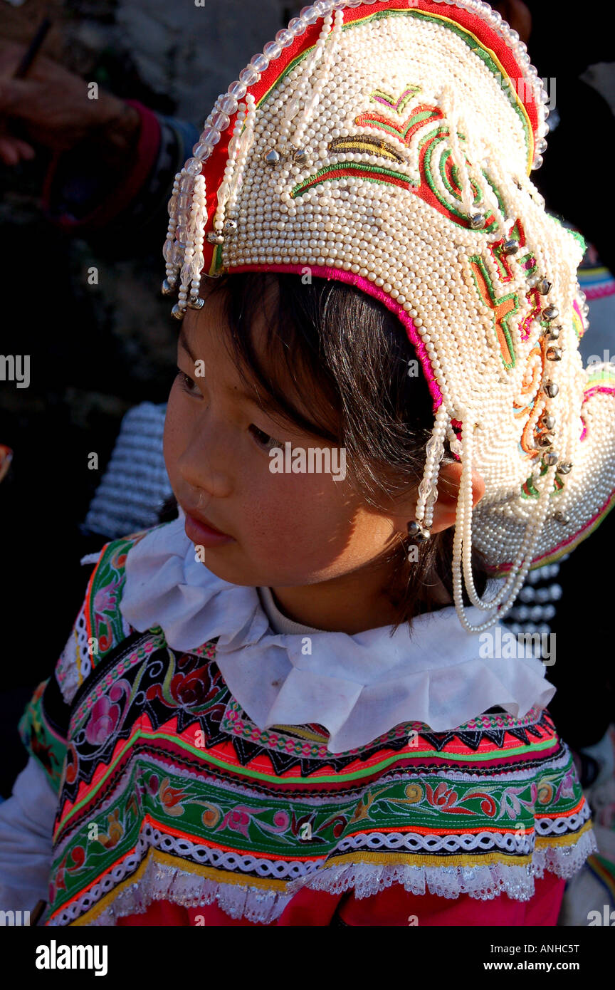 a girl have Yunnan Hani minority traditional clothes go to festival ...