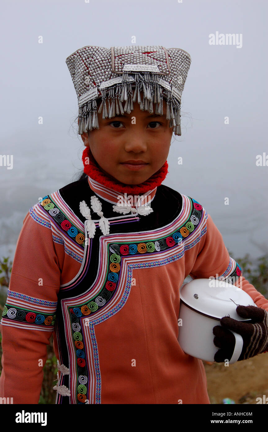 a girl have Yunnan Hani minority traditional clothes go to festival ...