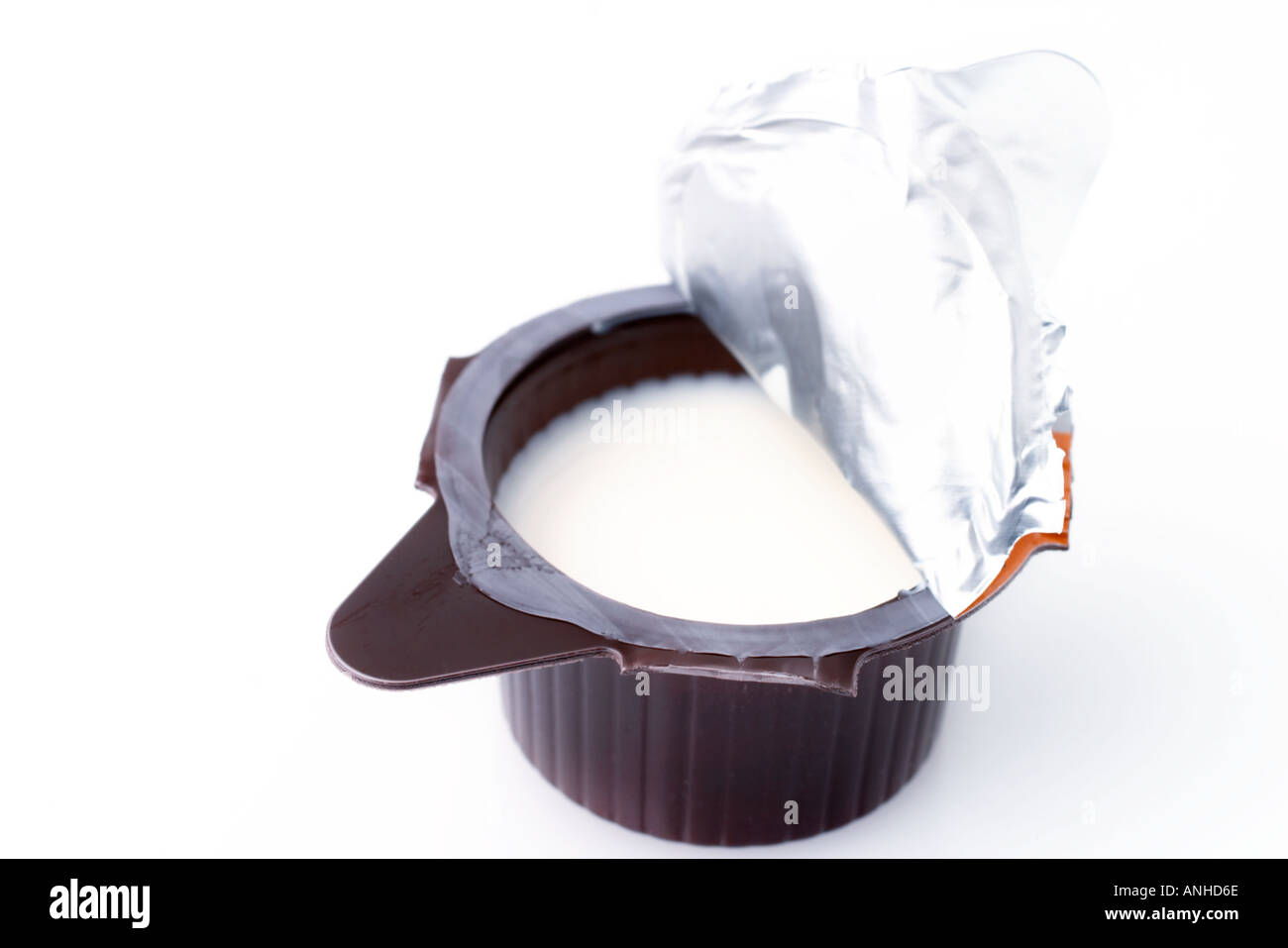 Condensed milk in convenience container Stock Photo - Alamy