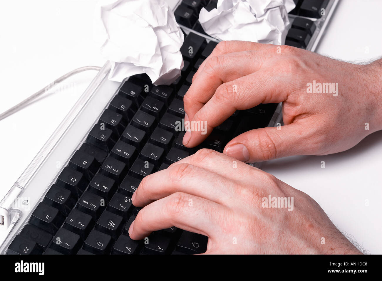 Man tying using a keyboard Stock Photo - Alamy