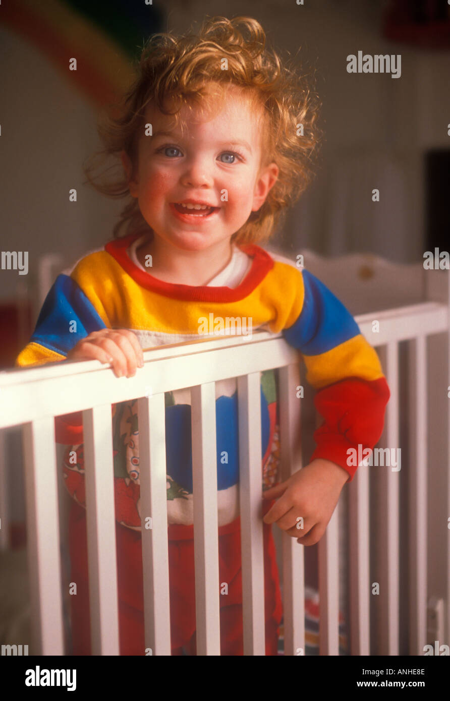 Happy Toddler in Crib Stock Photo - Alamy