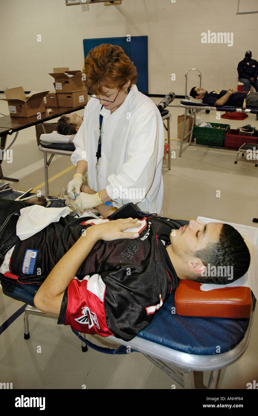 High school students volunteer to donate blood during a Red Cross Blood ...