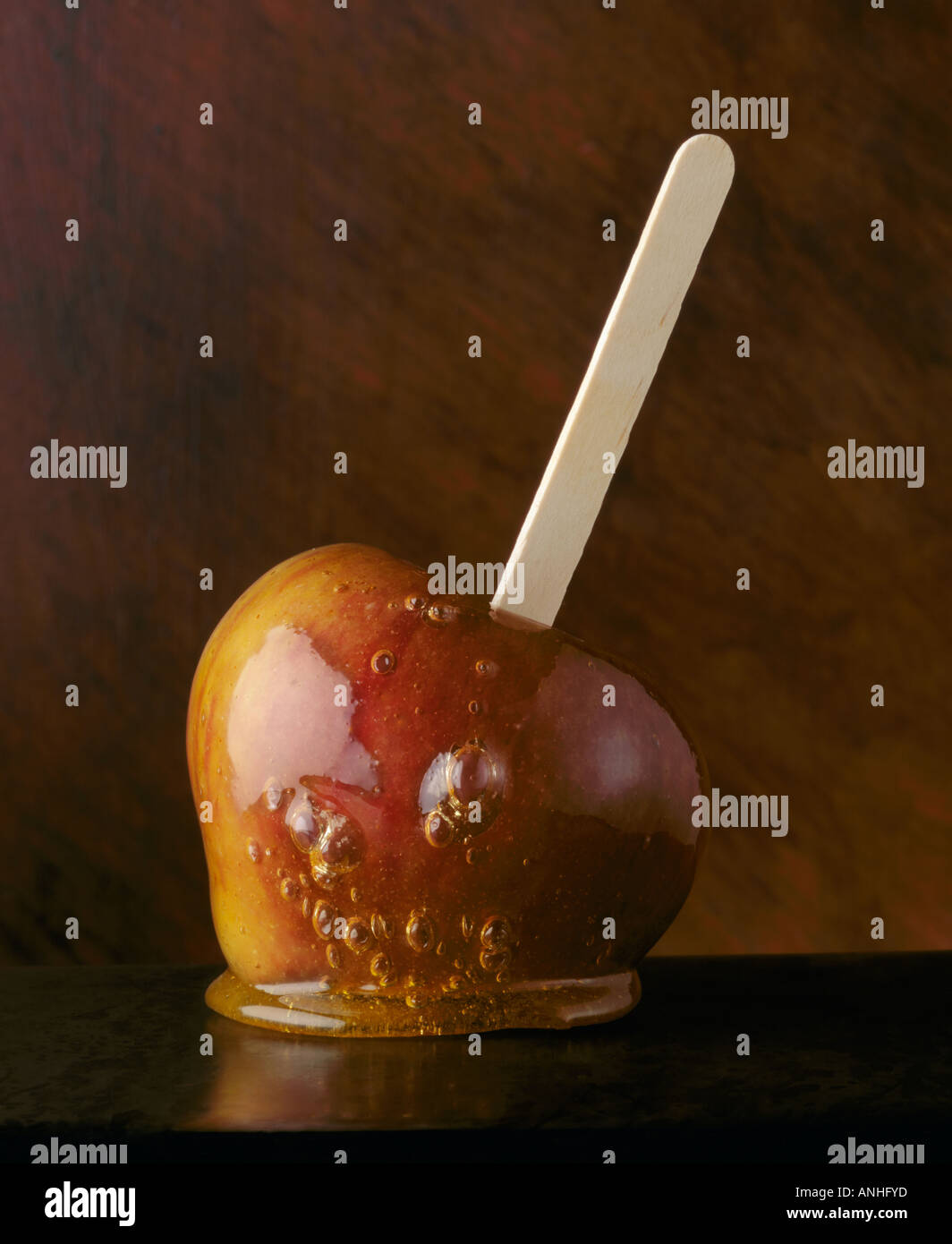 Toffee apple on a stick Stock Photo - Alamy
