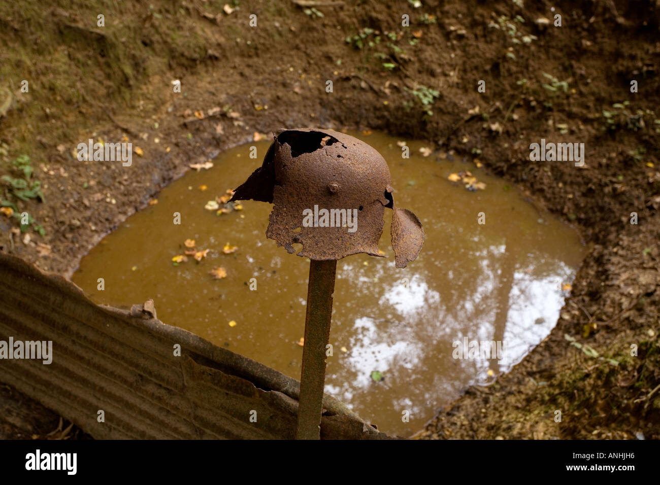 Rusty old helmet and preserved WW1 shell holes and trenches at ...