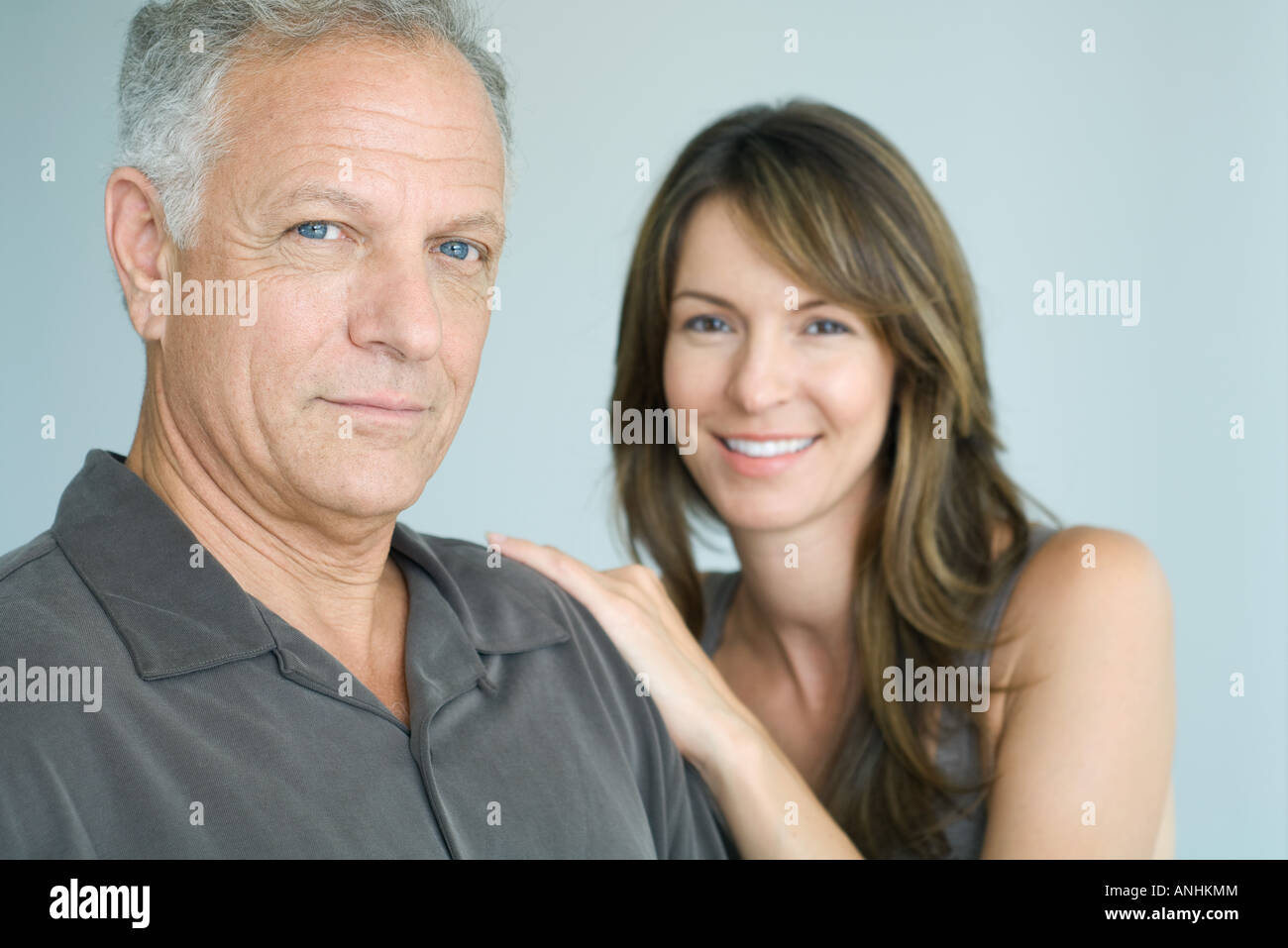 Man and woman smiling at camera, portrait Stock Photo - Alamy