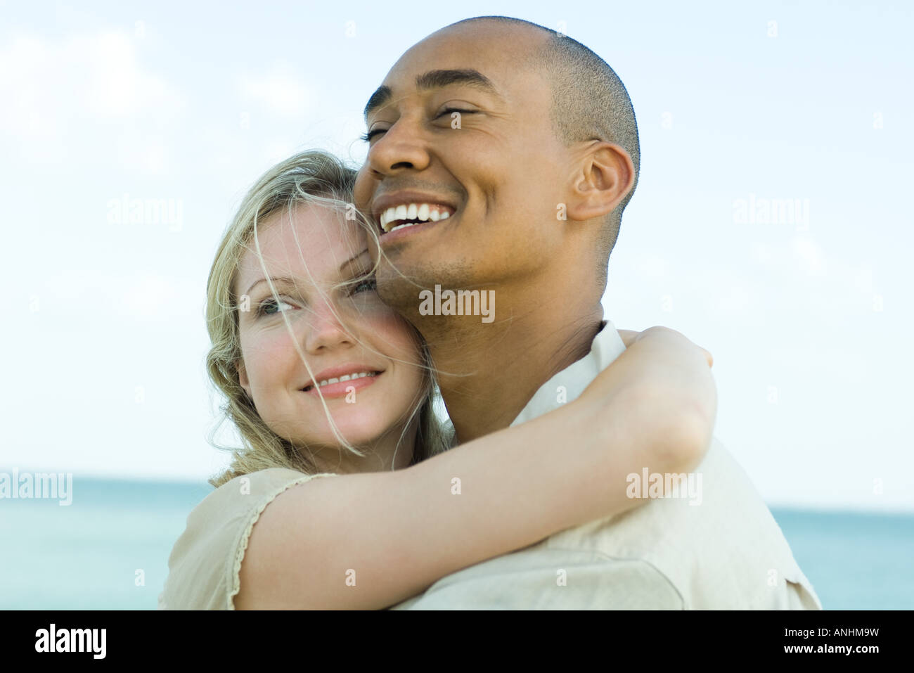 Couple embracing and smiling outdoors, close-up Stock Photo - Alamy