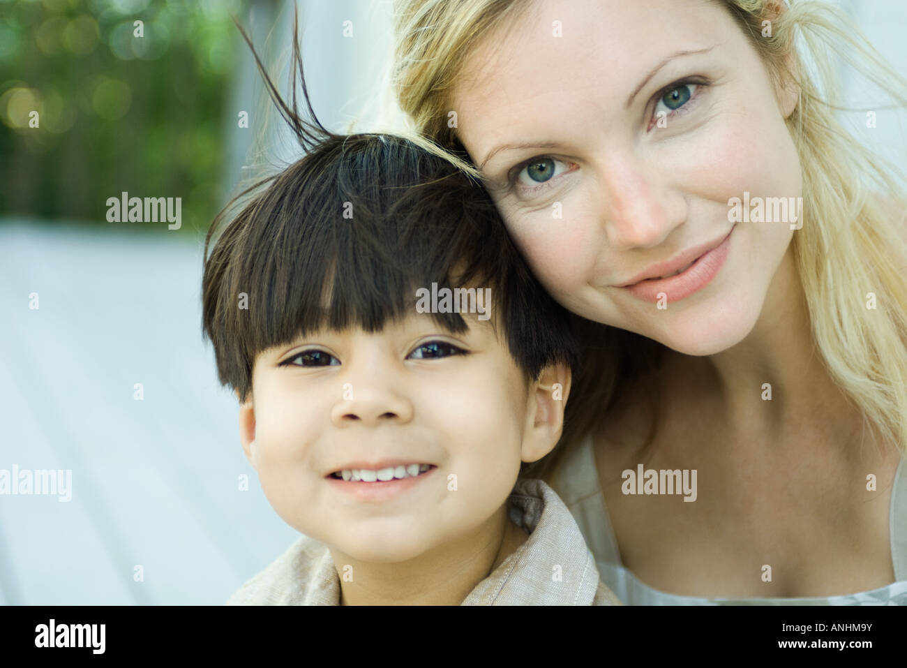 Mother and son smiling at camera, portrait Stock Photo - Alamy