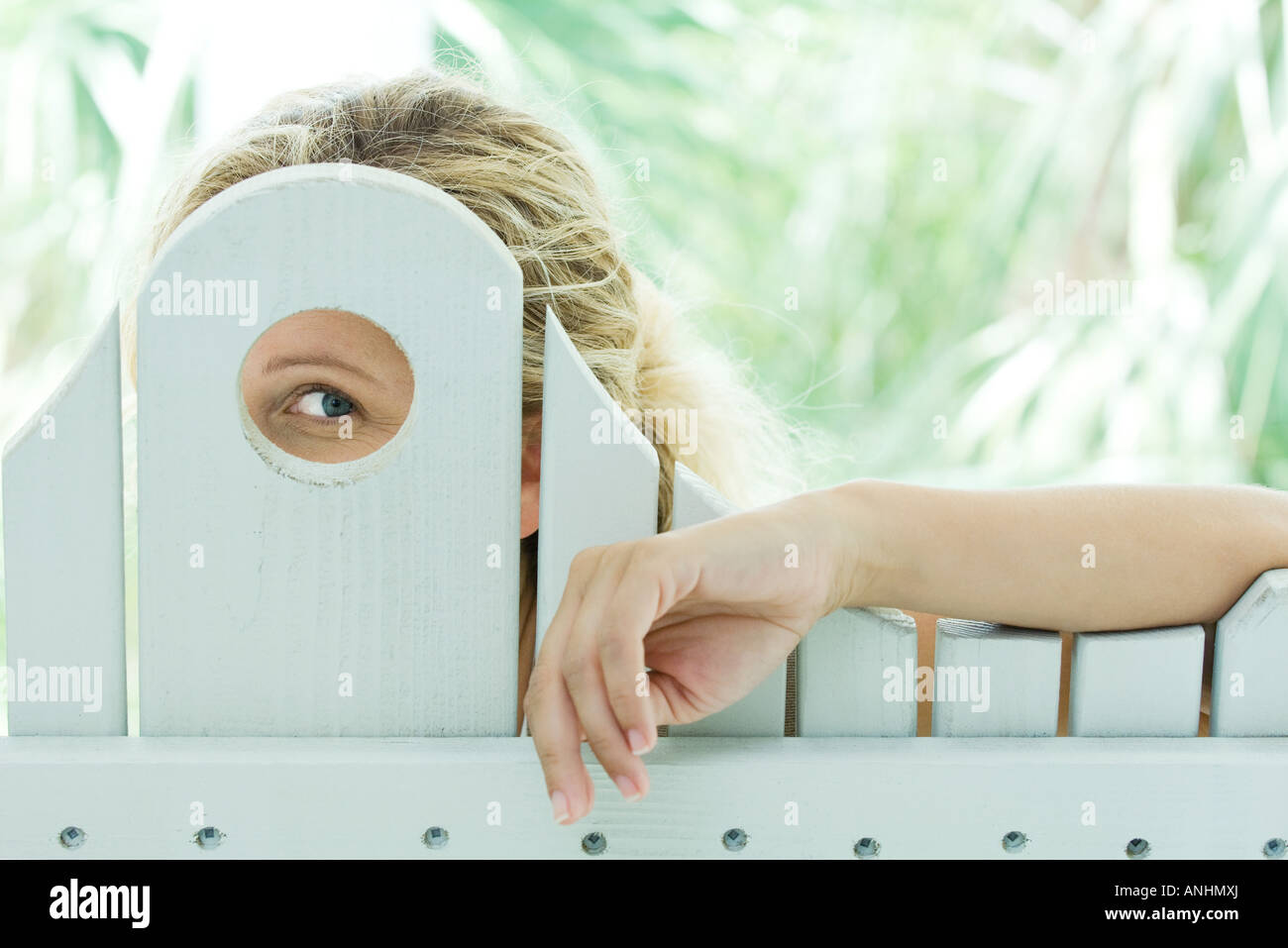 Woman peeking sideways hi-res stock photography and images - Alamy