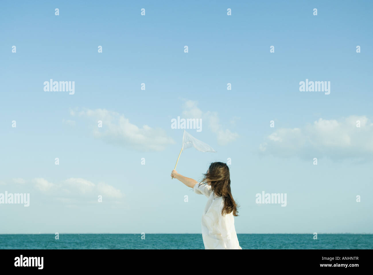 Woman catching clouds with butterfly net Stock Photo - Alamy