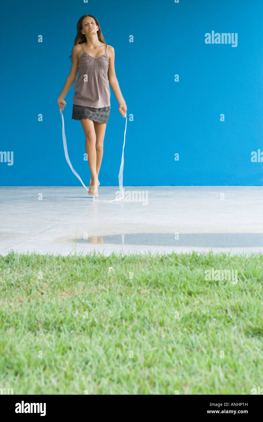 Teenage girl jumping rope, full length Stock Photo - Alamy