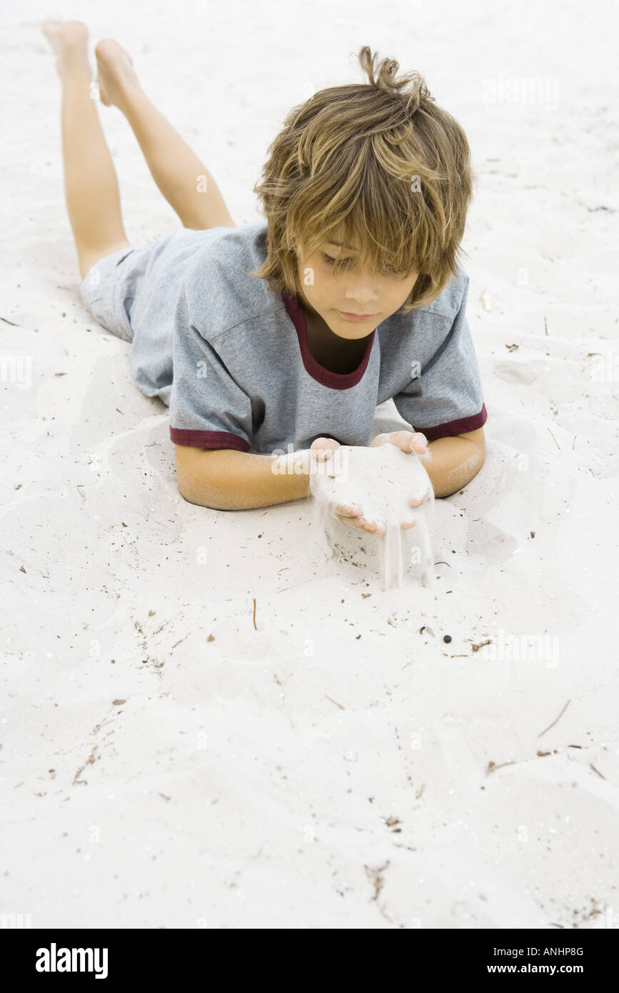 Children lying on sand hi-res stock photography and images - Alamy