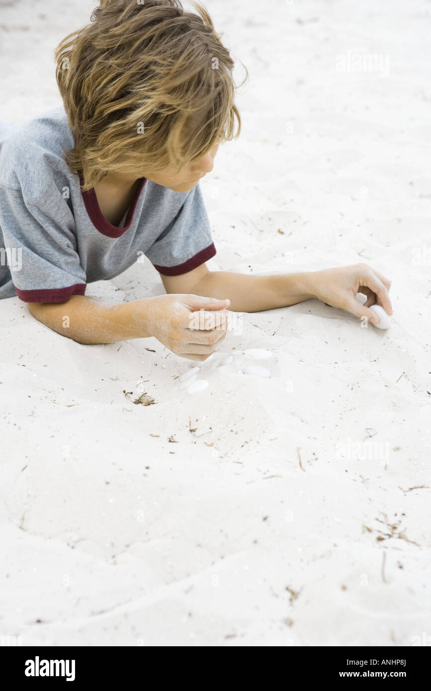 Children lying on sand hi-res stock photography and images - Alamy