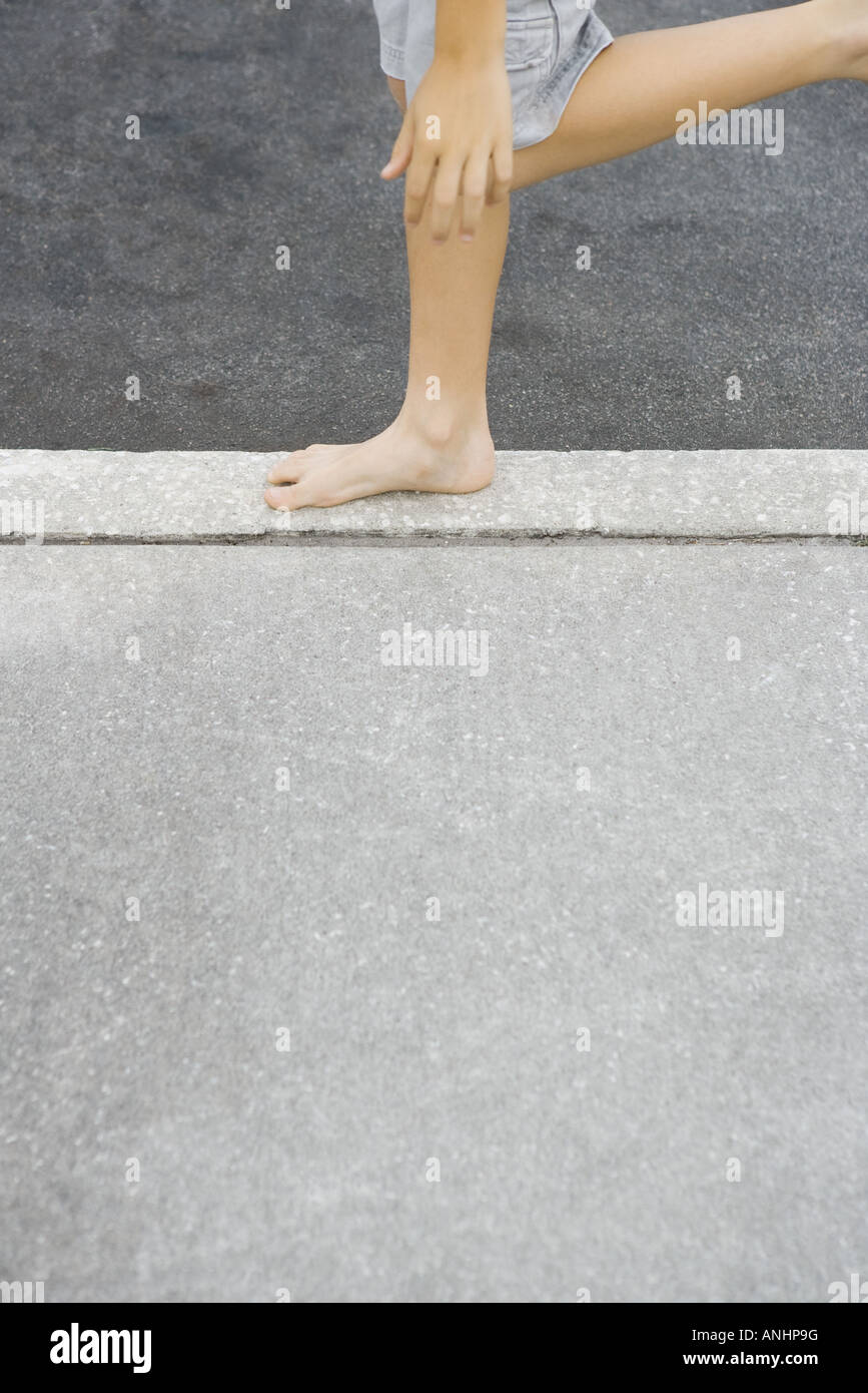 Child standing on one leg, cropped high angle view Stock Photo - Alamy