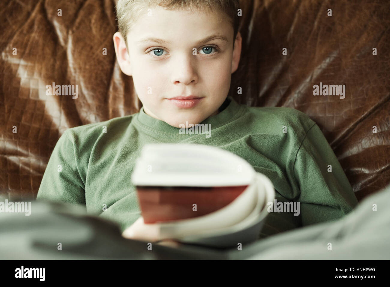 Boy reading book Stock Photo - Alamy