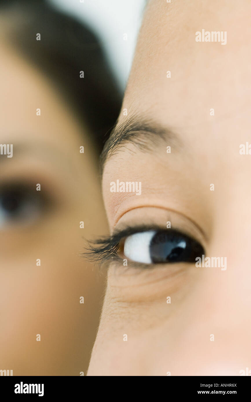 Teenage girl looking at camera, cropped view of eye Stock Photo - Alamy