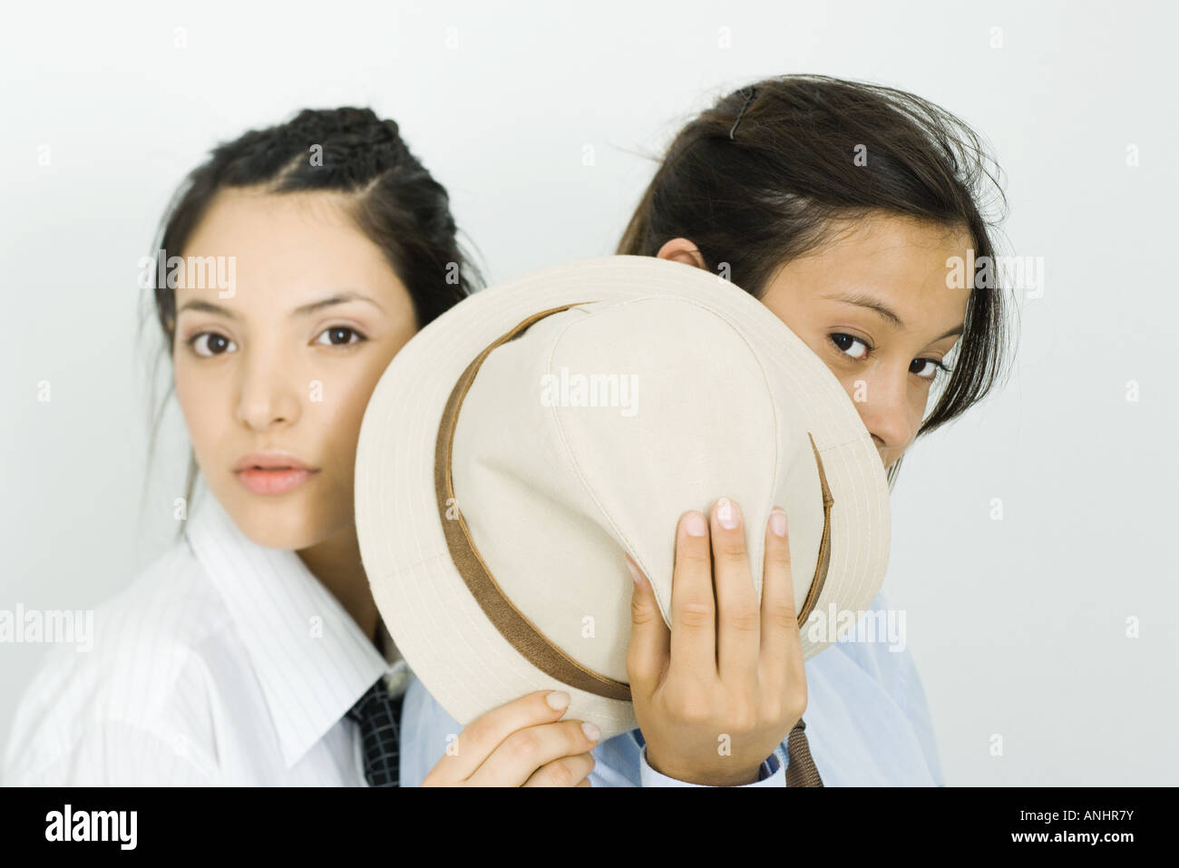 Girls hiding their heads hi-res stock photography and images - Alamy