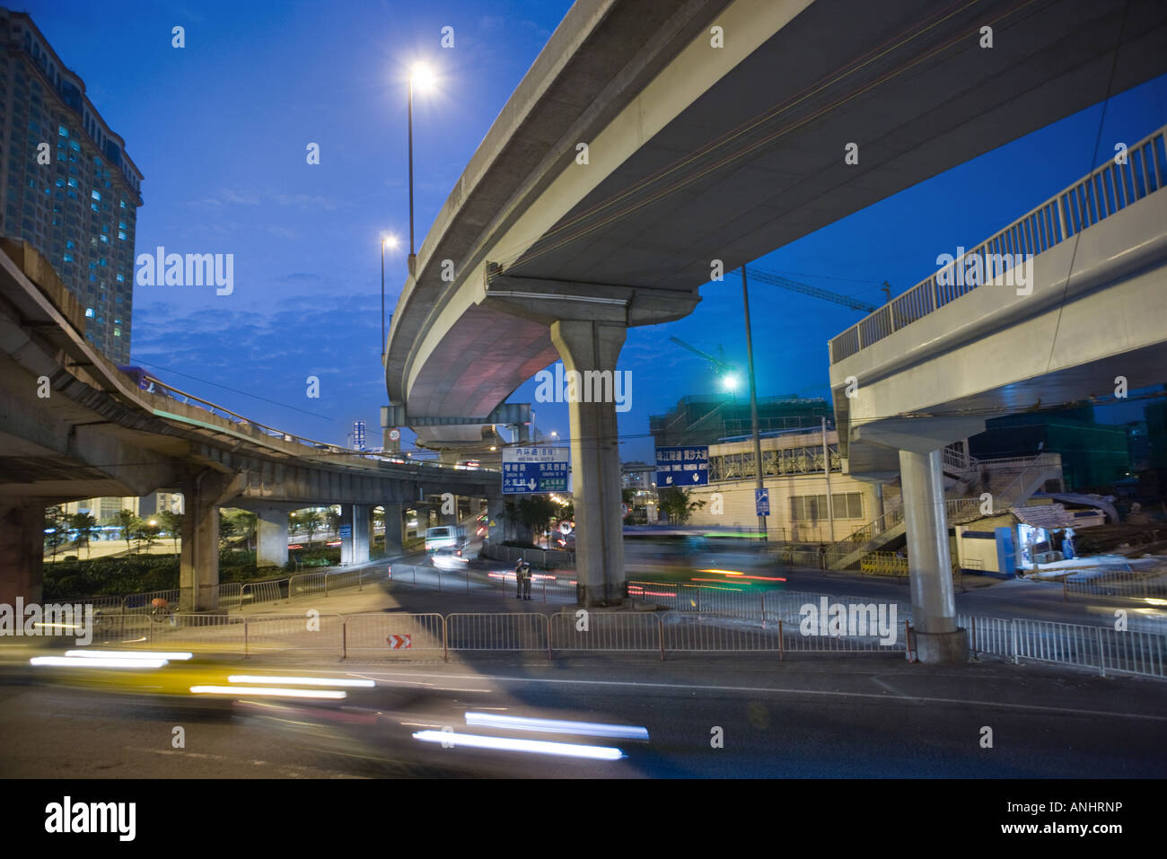City traffic under overpass at night Stock Photo - Alamy