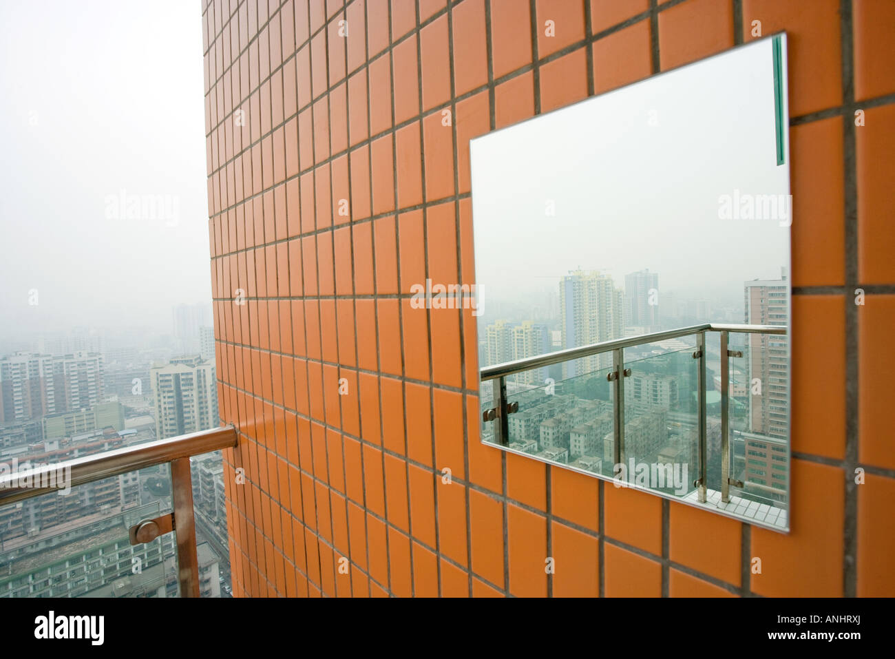 Mirror on outer wall reflecting cityscape Stock Photo - Alamy