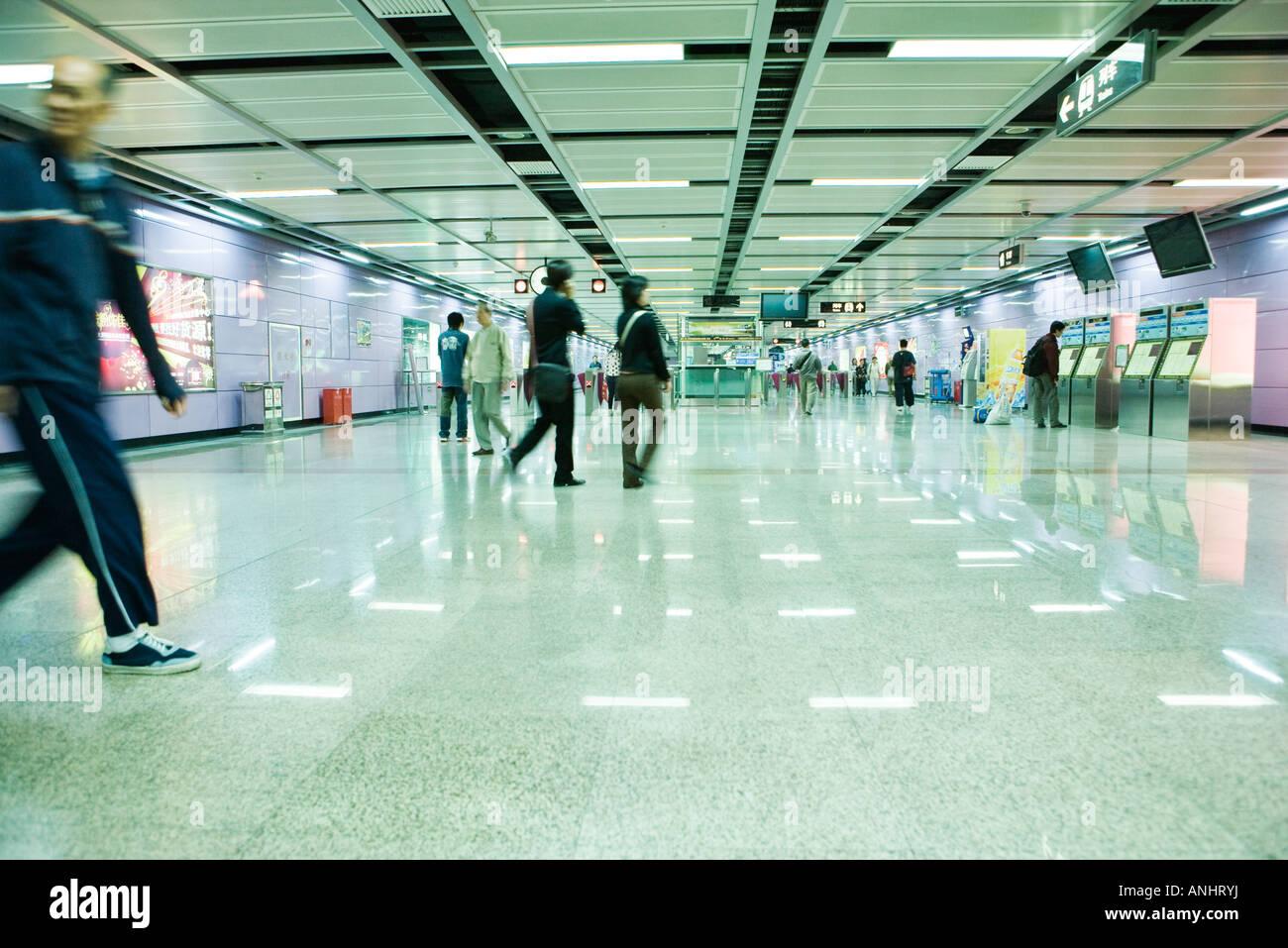 Commuters walking through subway corridor Stock Photo - Alamy