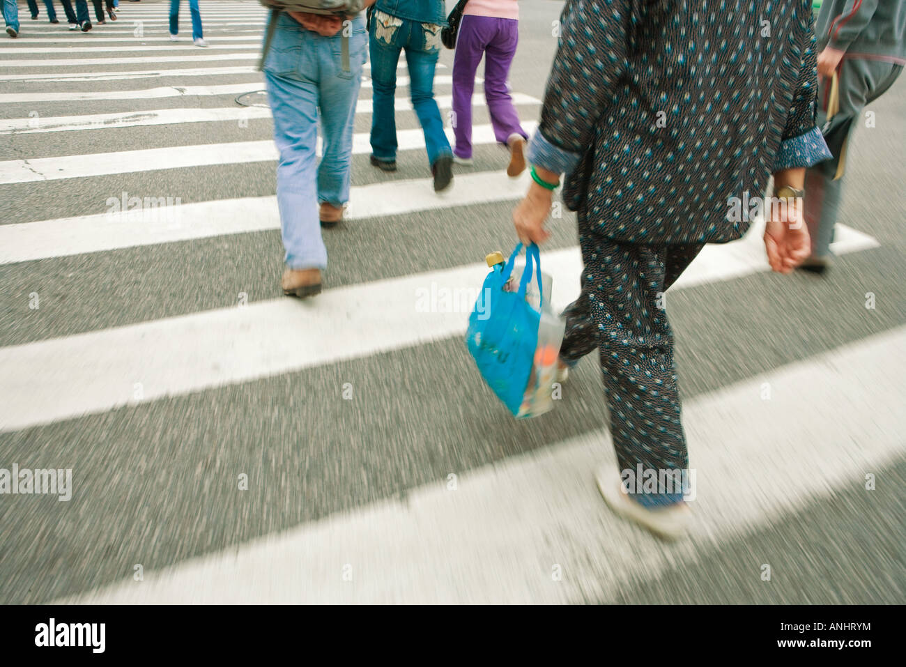 Pedestrians crossing on crosswalk Stock Photo - Alamy
