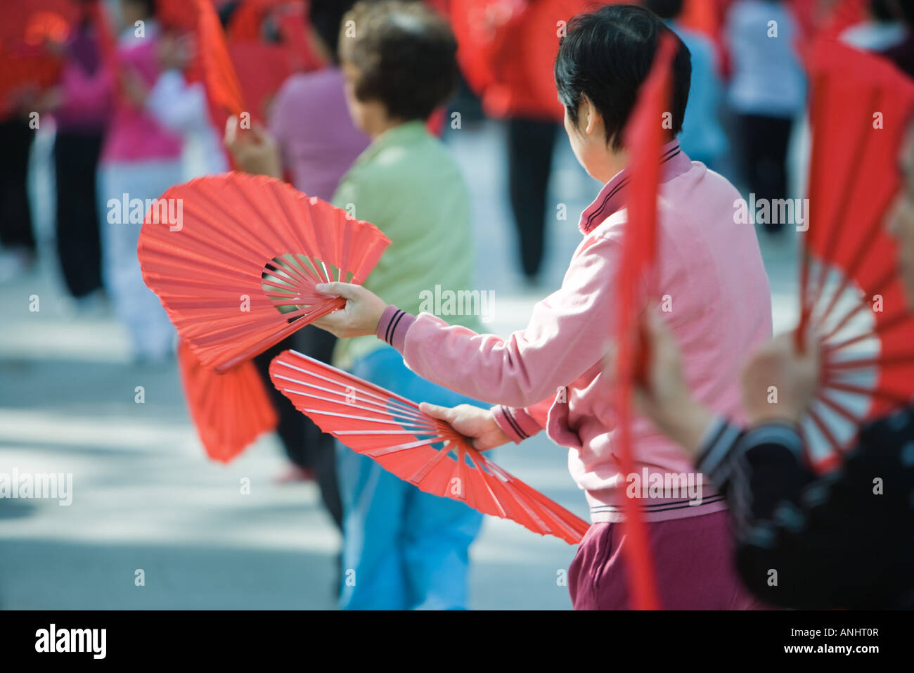 China, women dancing with fans, outdoors Stock Photo - Alamy