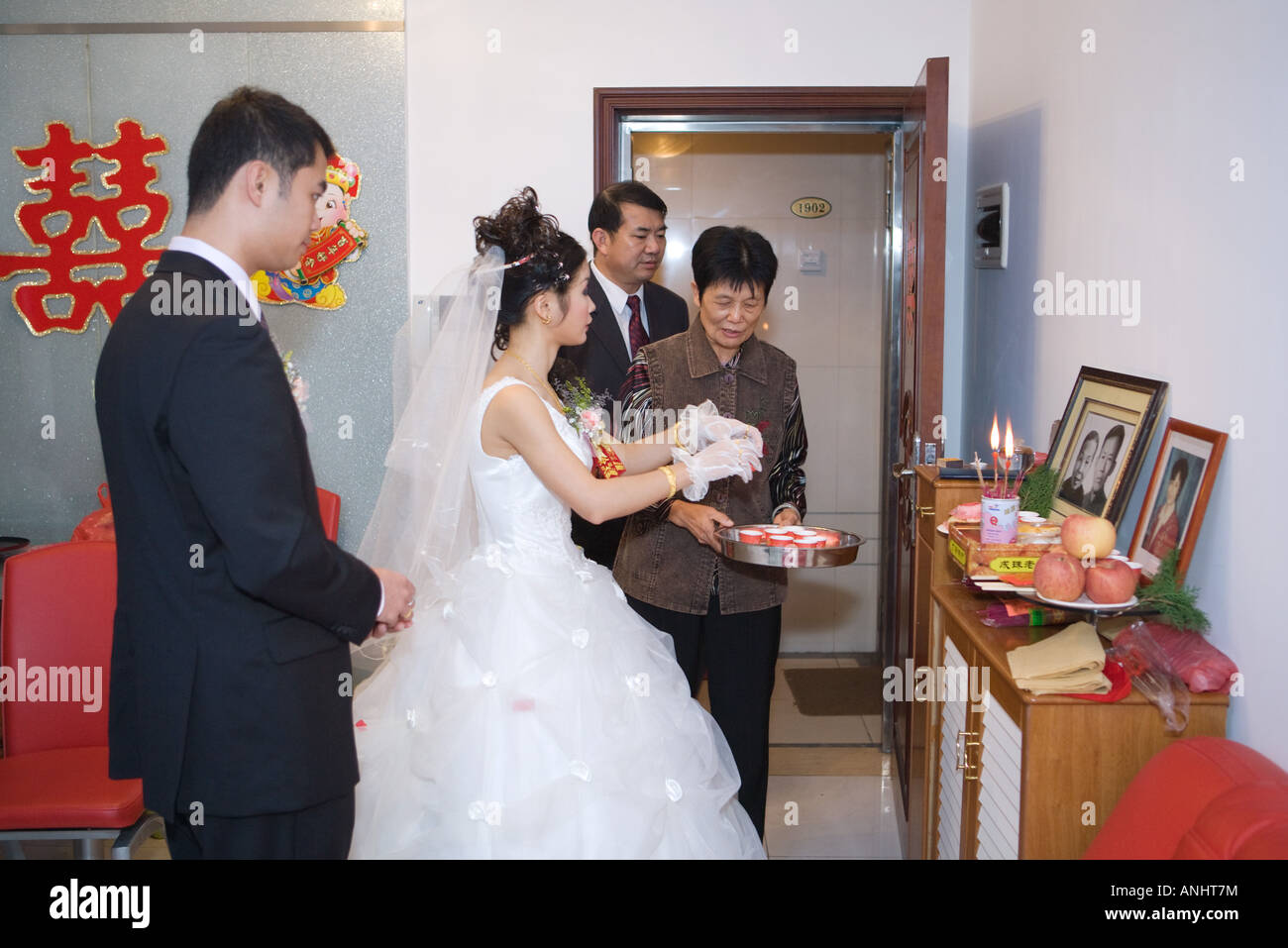 Chinese wedding, bride taking offering to ancestral shrine Stock Photo ...