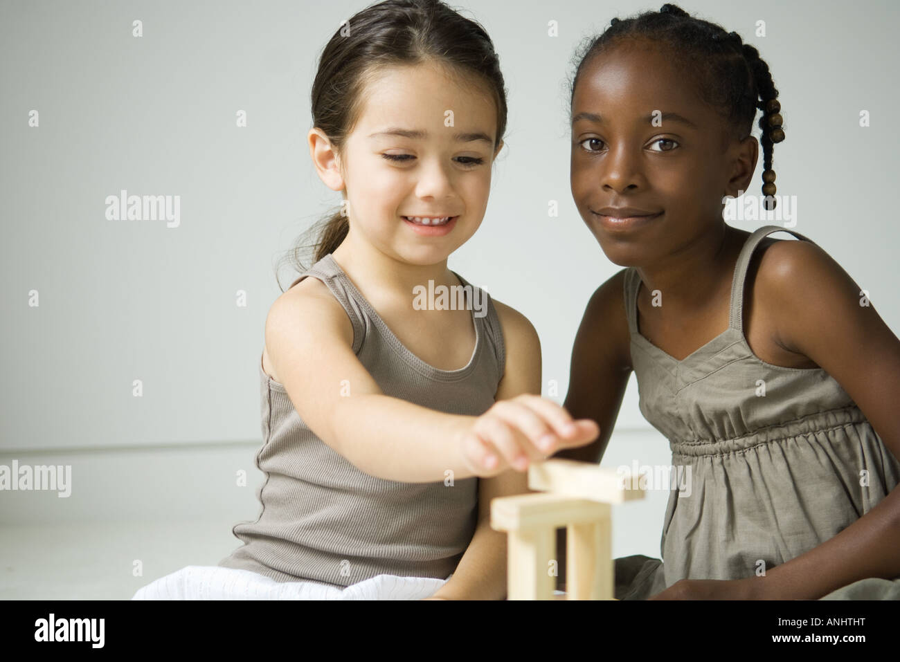 African girl building tower of blocks hi-res stock photography and ...