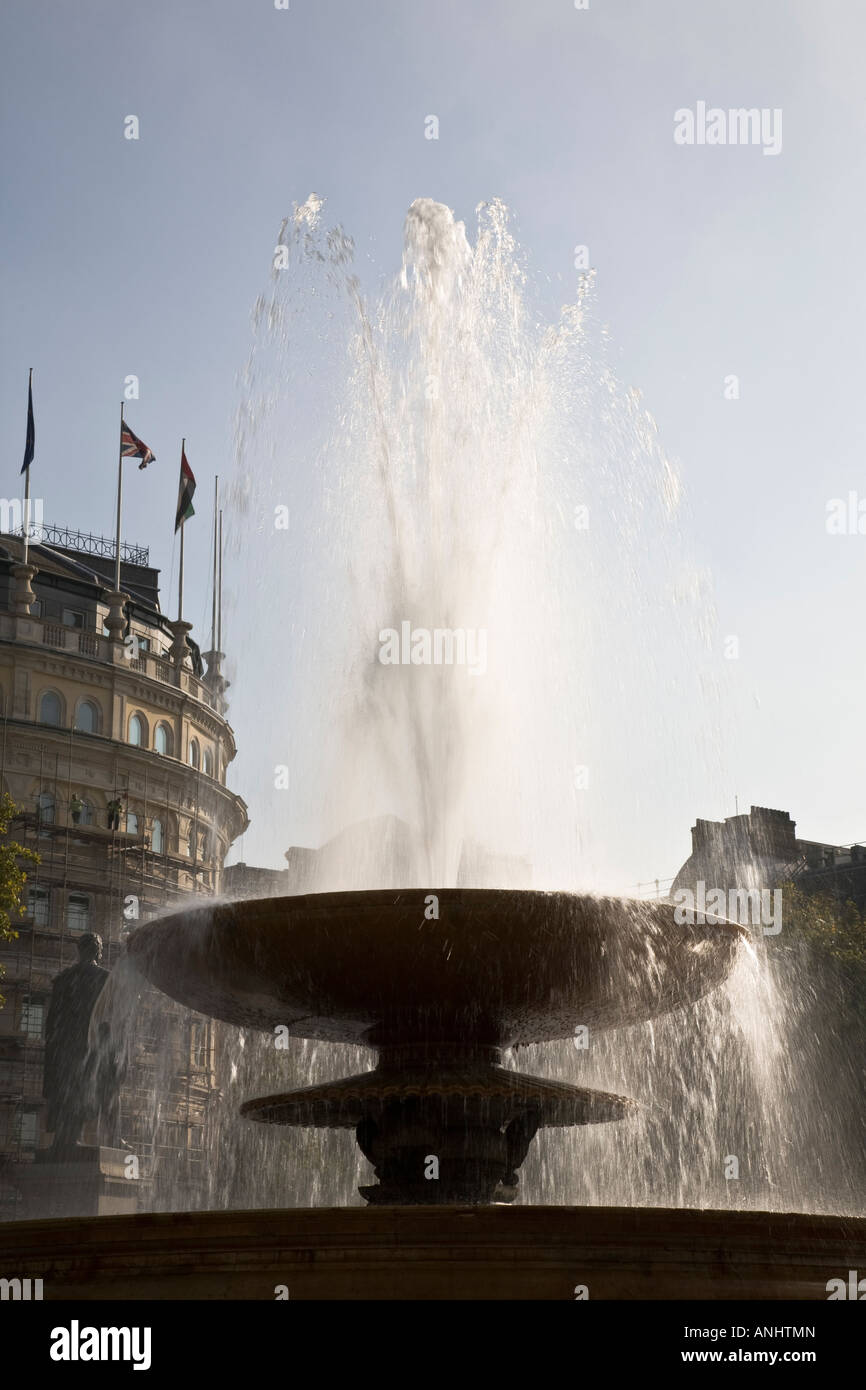 Sun catching the spray of a fountain in Trafalgar Square with the ...